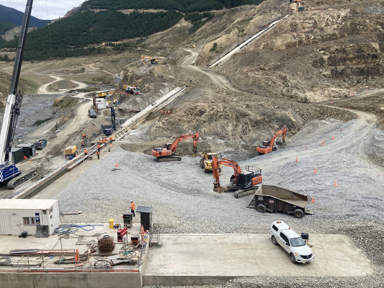 First layer of hand-made kerb being place on top of starter dam plinth ...